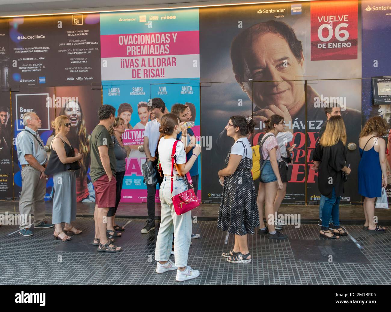 People queue to enter a theatre on Corrientes Avenue, Buenos Aires ...