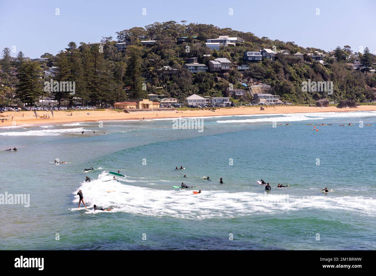People surfing in the ocean off Palm Beach on Sydney northern beaches ...