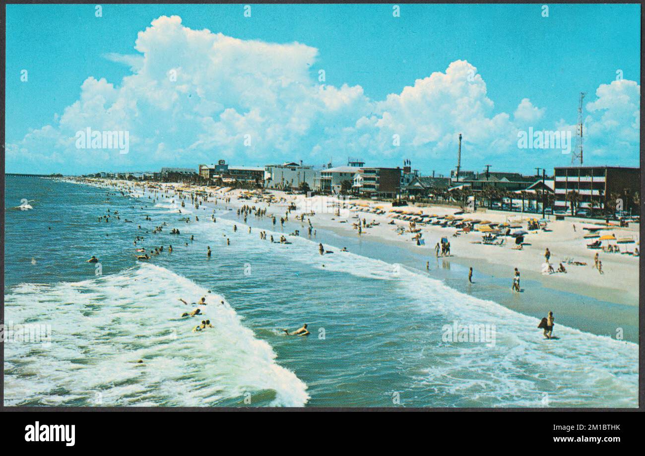 Warm surf beckons to the many vacationers enjoying the modern ...