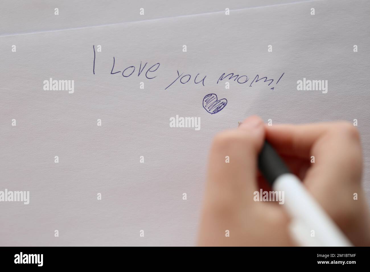 Mothers day holiday.moms day. I love you mom inscription on a white ...