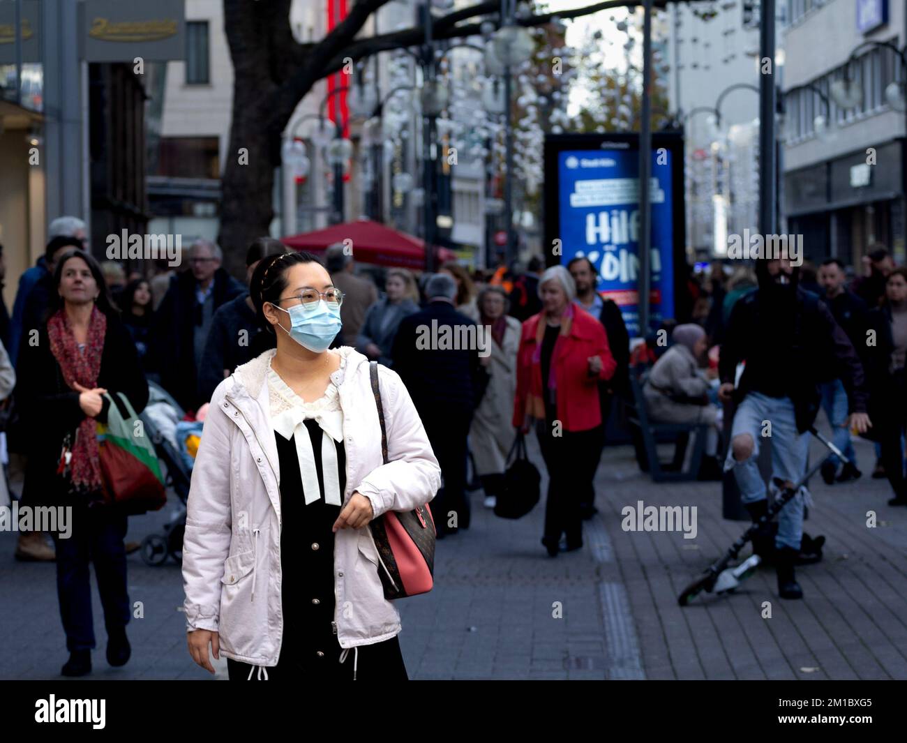 Picture of a young asian people walking in the streets of Cologne ...