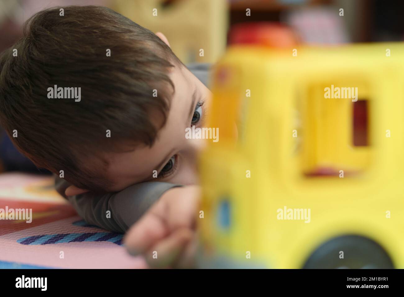 young boy playing with toys at home Stock Photo - Alamy