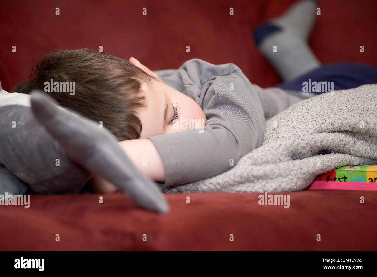 little boy taking a nap on the couch Stock Photo - Alamy