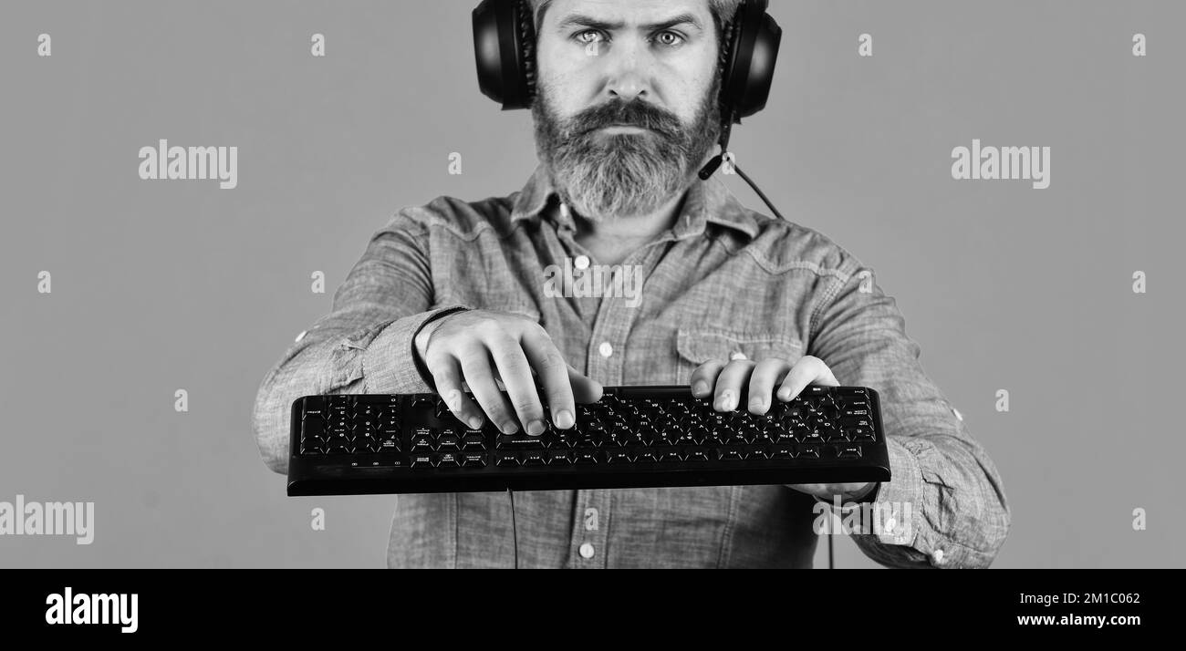 Run any modern game. Play computer games. Man bearded hipster gamer ...