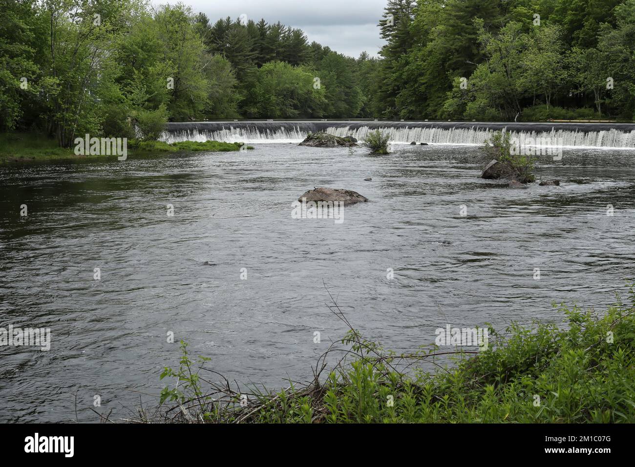 This river is 117 miles long in NH and Mass. It merges from the ...