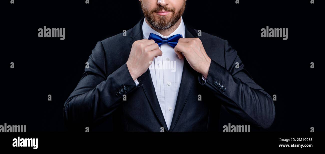 cropped view of tuxedo man in formal wear at studio. tuxedo man with ...