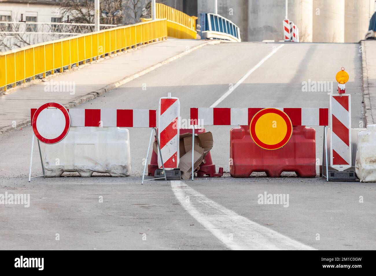 Picture of roadsigns and road barriers blocking a street being ready ...