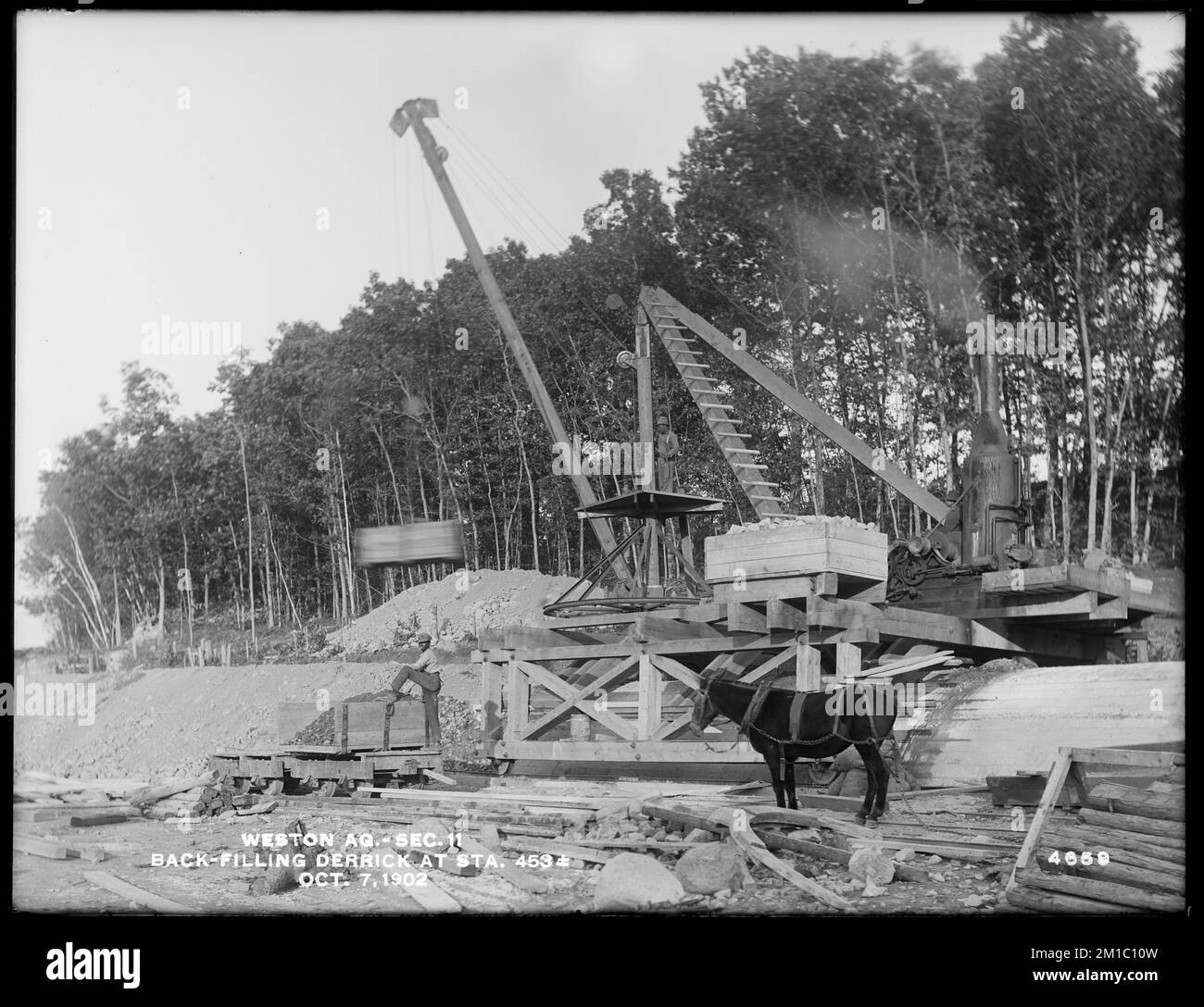 Weston Aqueduct, Section 11, backfilling derrick, at station 453± ...