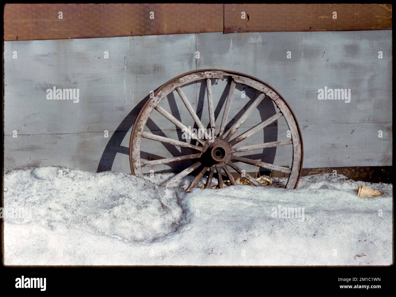Wheel in snow , Wheels. Edmund L. Mitchell Collection Stock Photo - Alamy