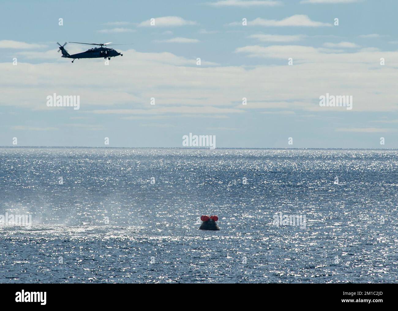 221211-N-NM271-3108 PACIFIC Ocean (Dec. 11, 2022) An MH-60 Seahawk ...