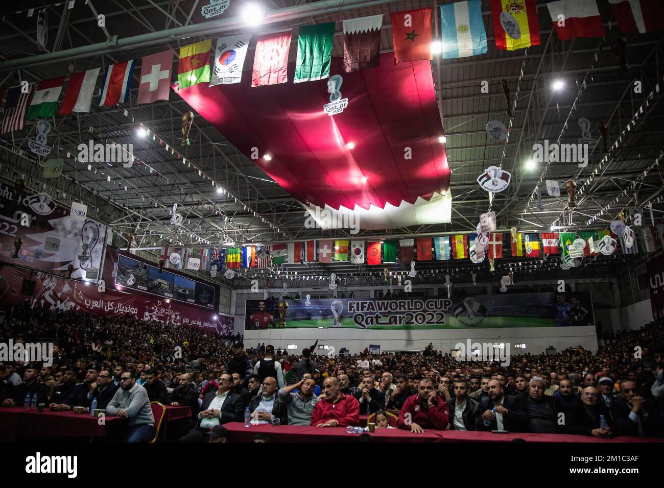 Gaza, Palestine. 10th Dec, 2022. Palestinians watch the live broadcast ...