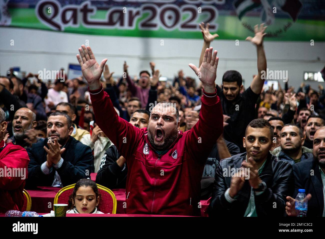 Palestinians react during a live broadcast of the FIFA World Cup ...