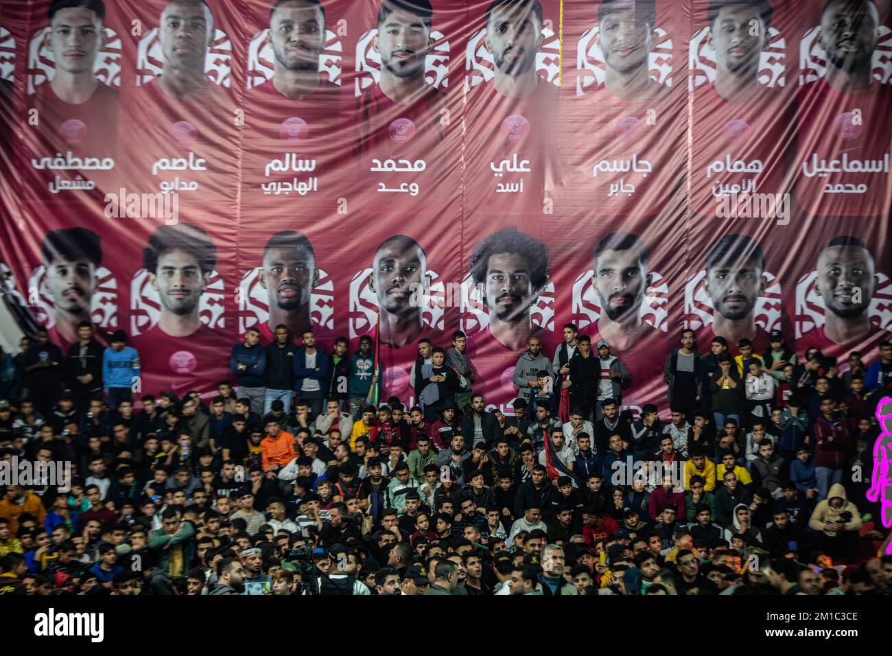 Gaza, Palestine. 10th Dec, 2022. Palestinians watch the live broadcast ...