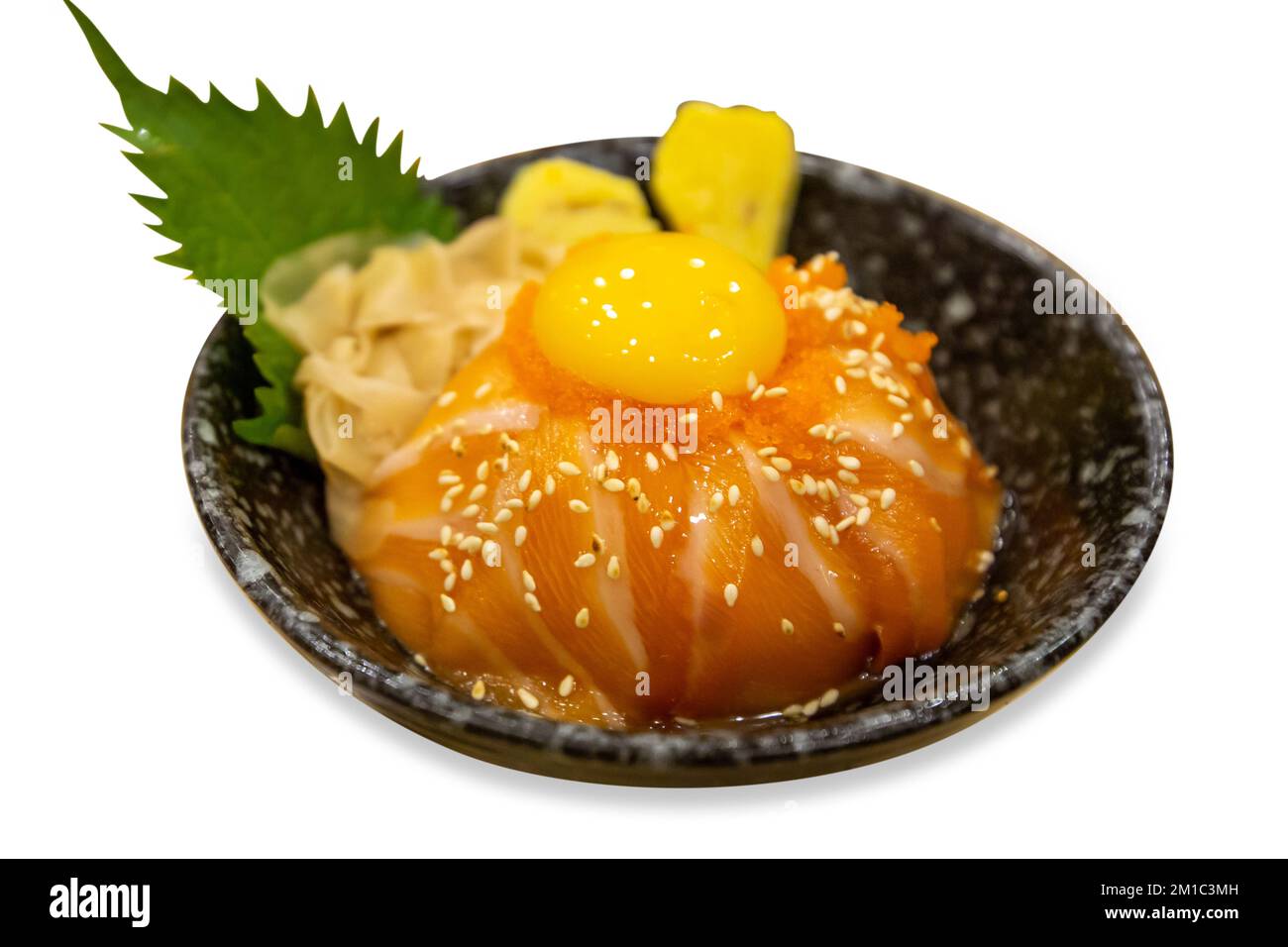 Die cut of Japanese rice bowl with sliced salmon sashimi Soft-boiled ...