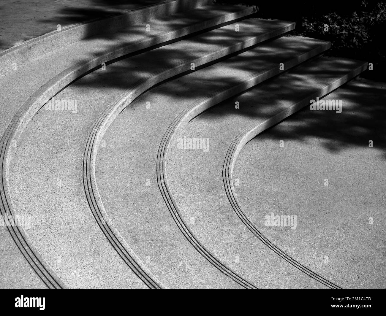 Outdoor curvilinear stone stairs in black and white style. Abstract ...