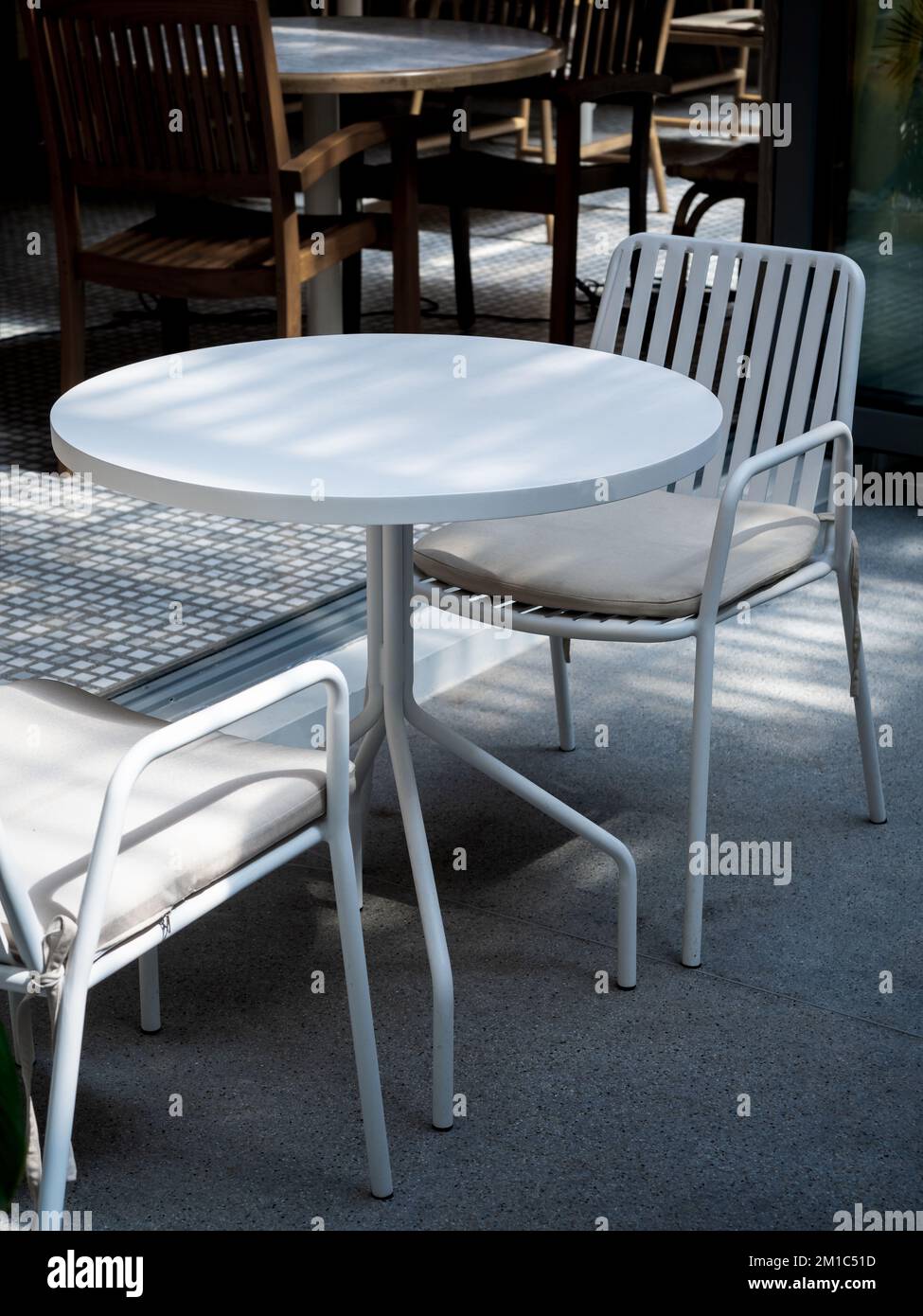 Outdoor small table set at the restaurant or cafe, vertical style ...