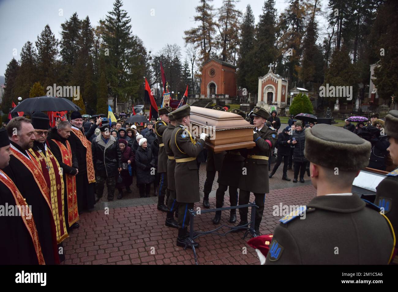 Lviv, Ukraine. 10th Dec, 2022. Military honor guards carry the coffin ...