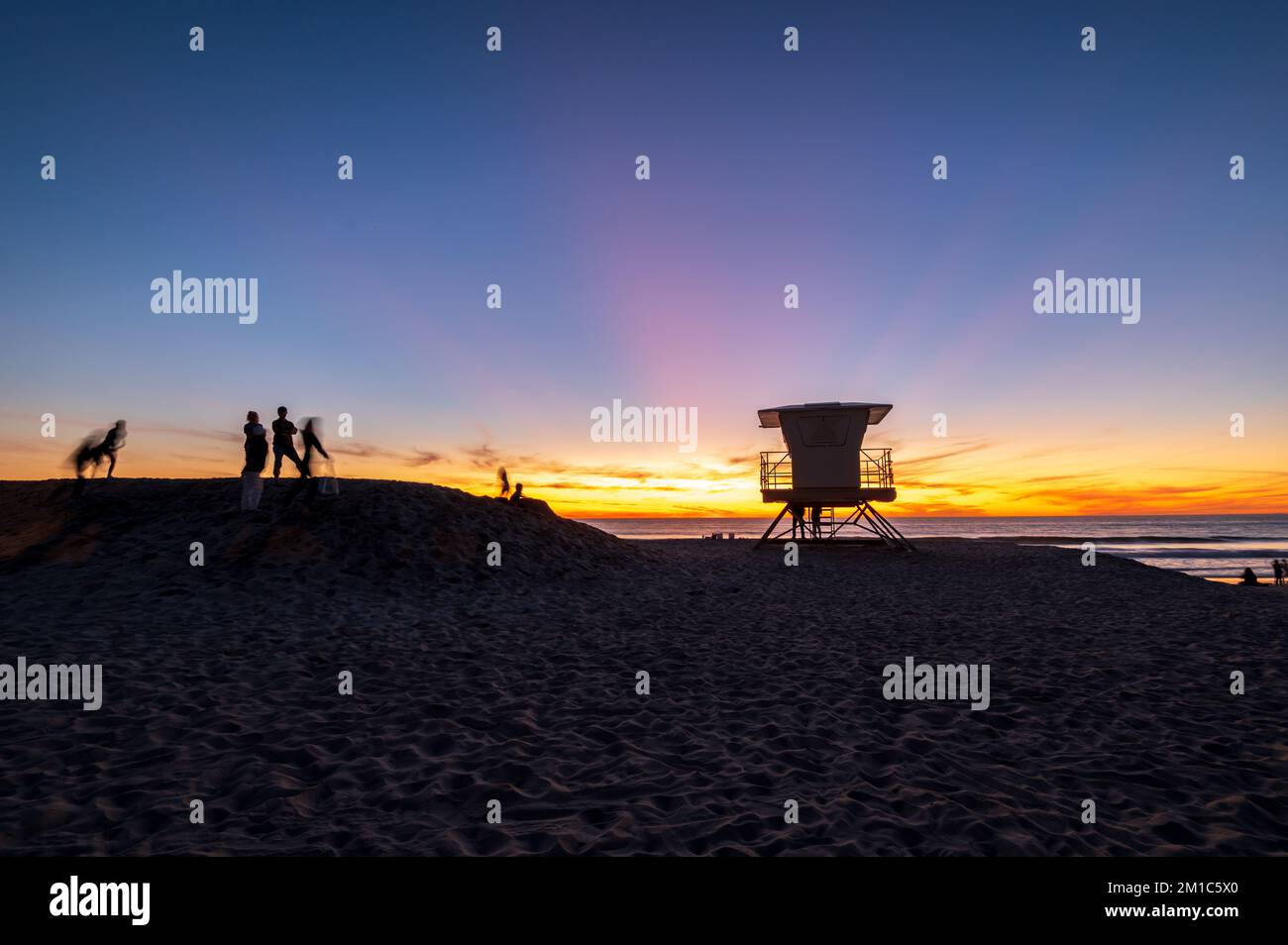 People watch a beautiful sunset in California Stock Photo - Alamy