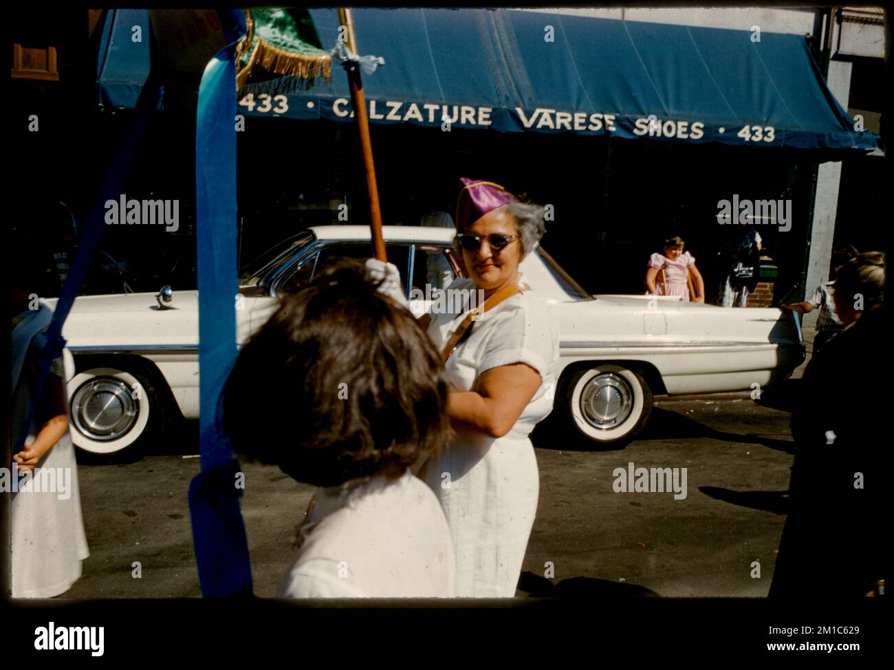 Woman carrying banner in parade, North End, Boston , Parades ...