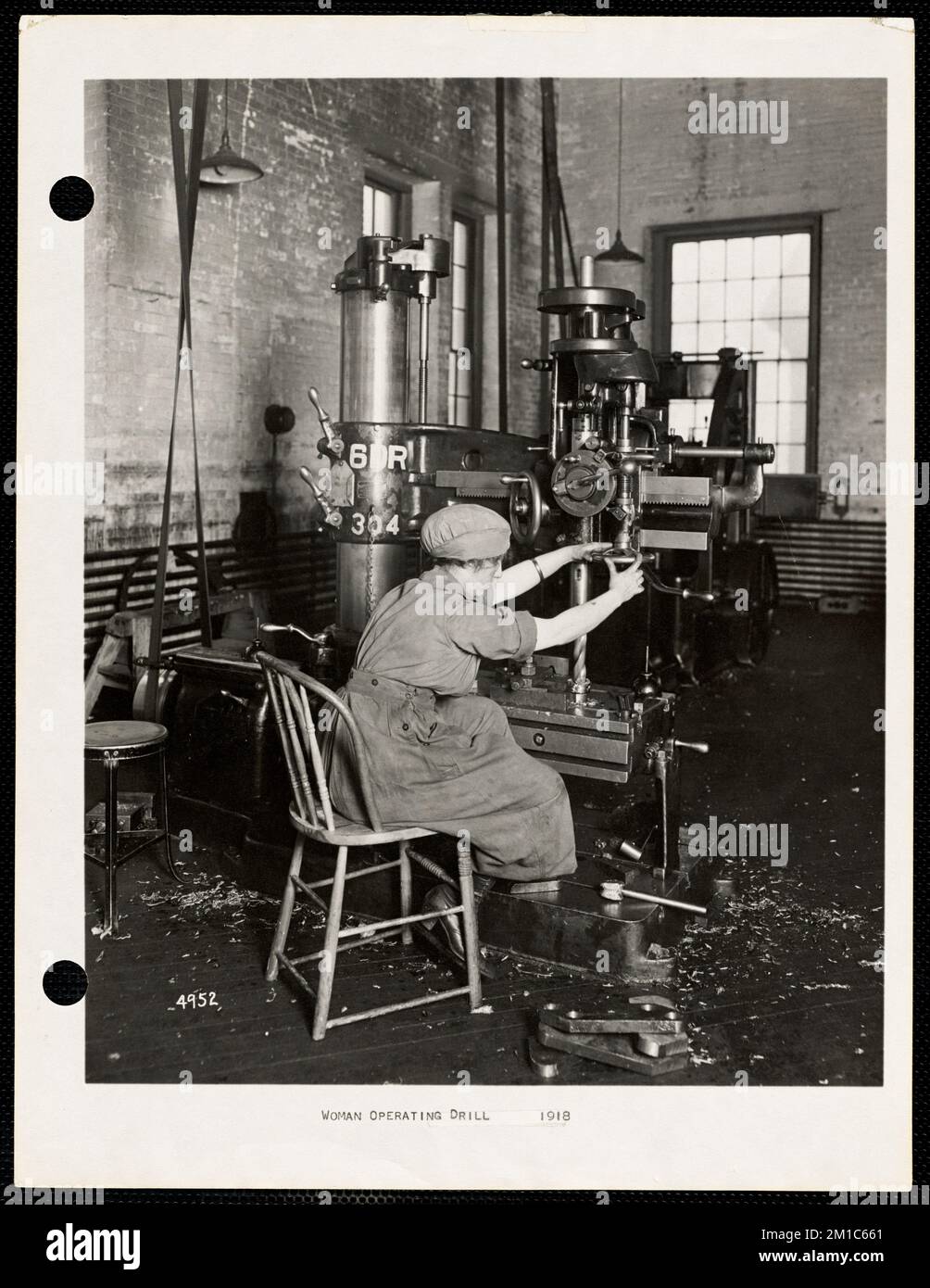 Woman operating drill , Armories, Ordnance industry, Drilling & boring ...
