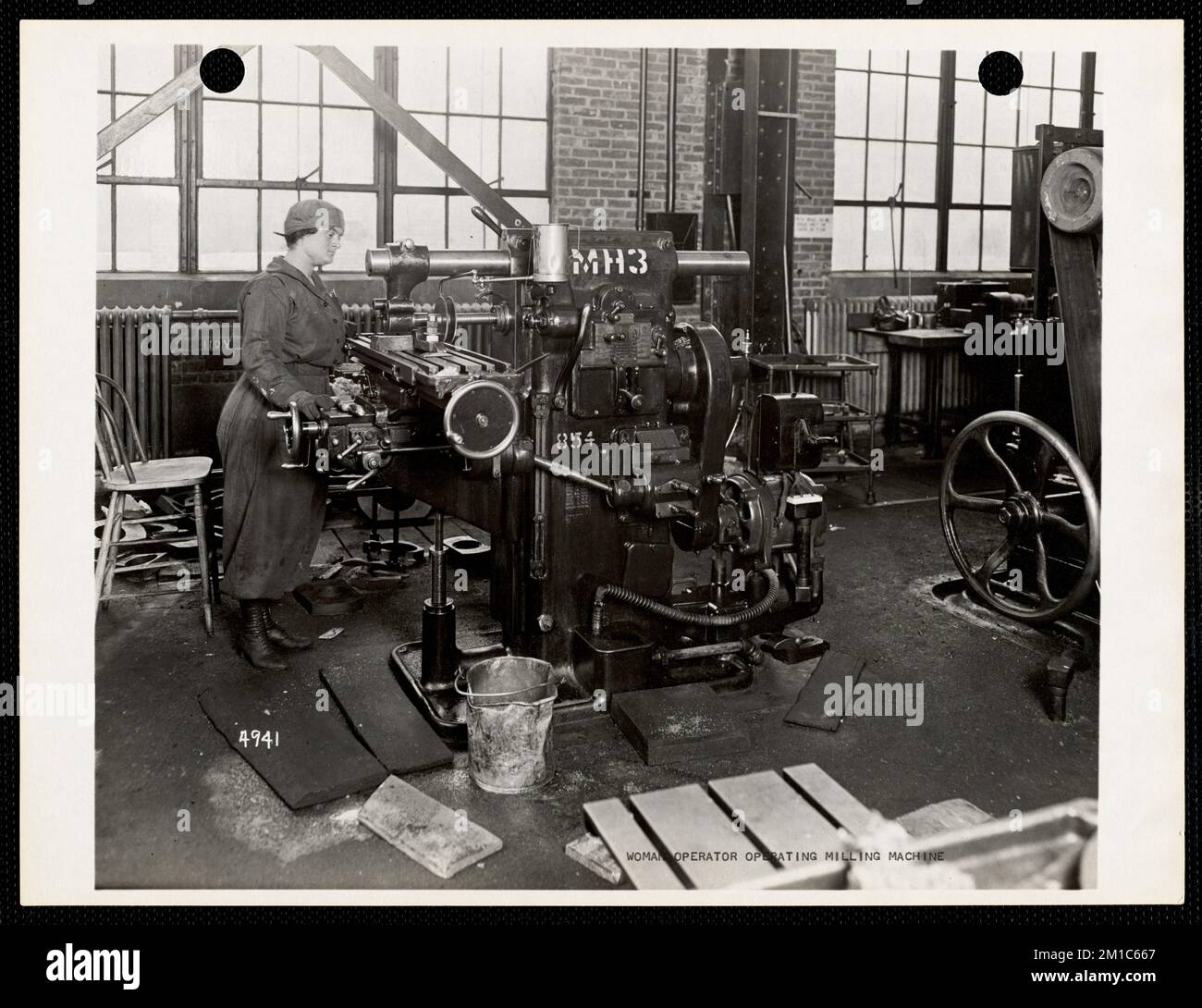 Woman operator operating milling machine , Armories, Ordnance industry ...