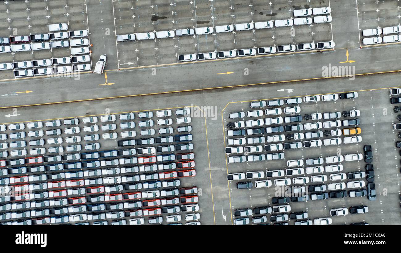Aerial view of new cars stock at factory parking lot. Above view cars ...