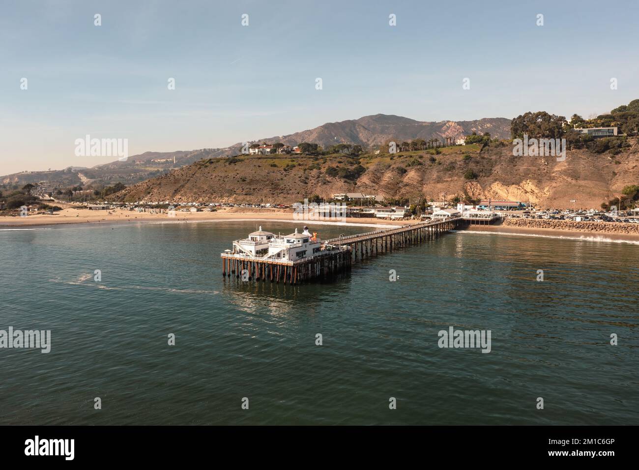 Aerial of historic Malibu Pier, Pacific Coast Highway and the Santa ...