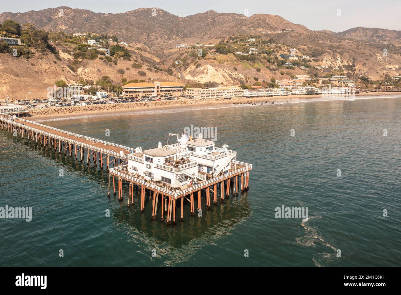 Aerial of historic Malibu Pier, Pacific Coast Highway and the Santa ...