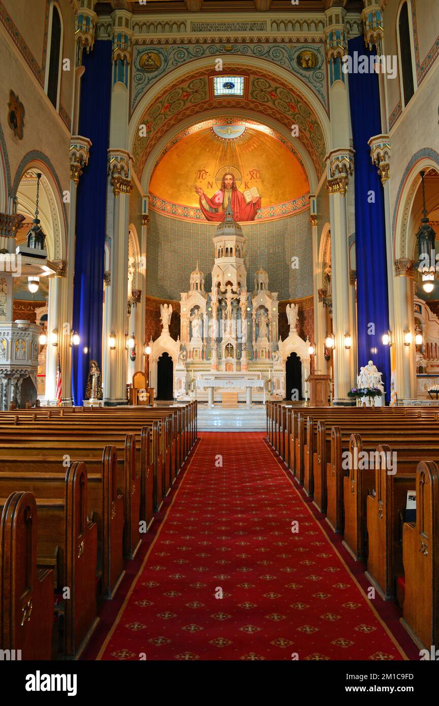 The aisles and pews lead to the main altar in the interior of Sts Peter ...