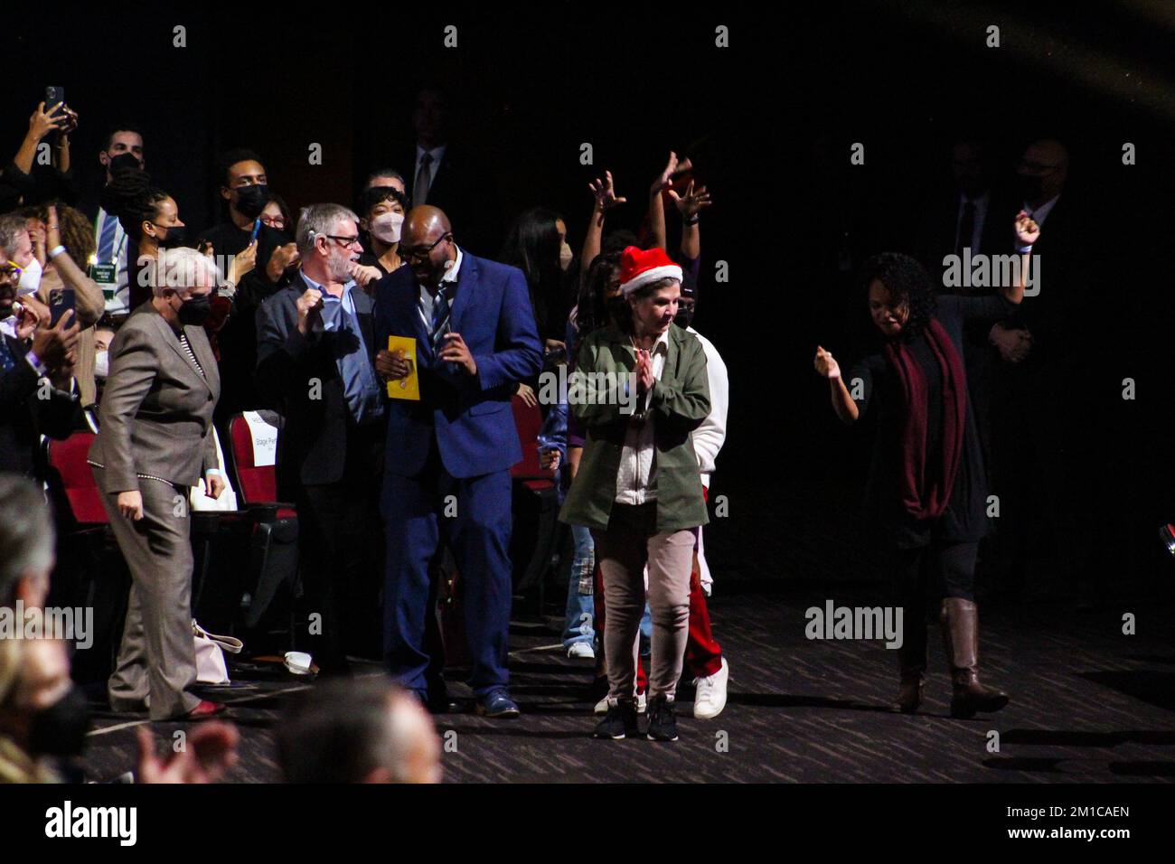 Attendees, including Amanda Gorman, dance during Stevie Wonder's ...