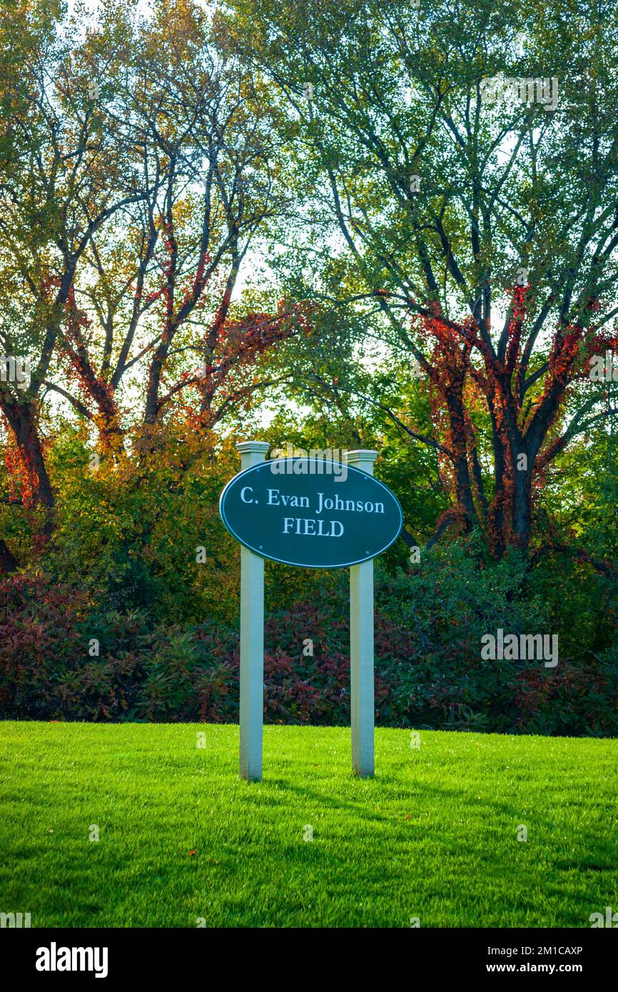Parks & Recreation sign. Green field and trees in fall foliage colors ...