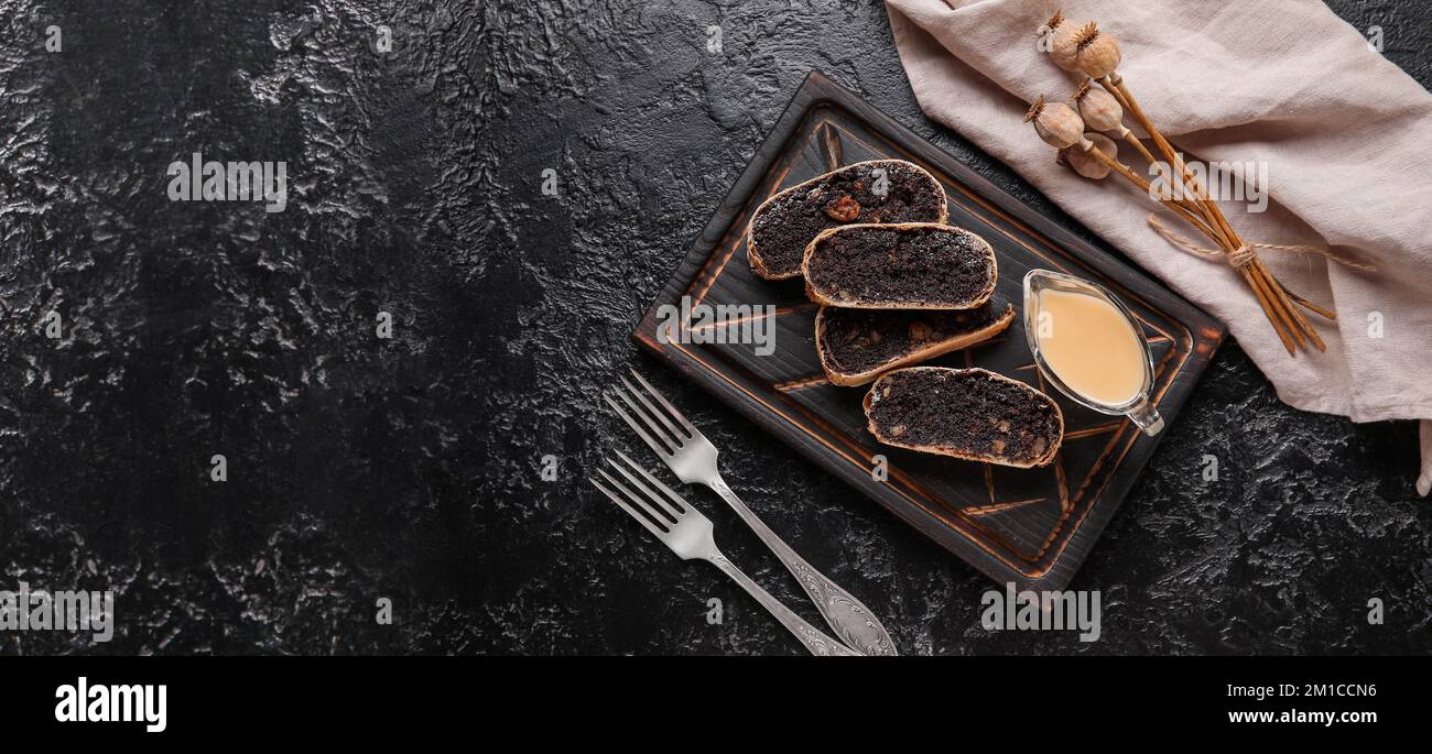 Pieces of tasty poppy seed strudel and sauce on black background with ...