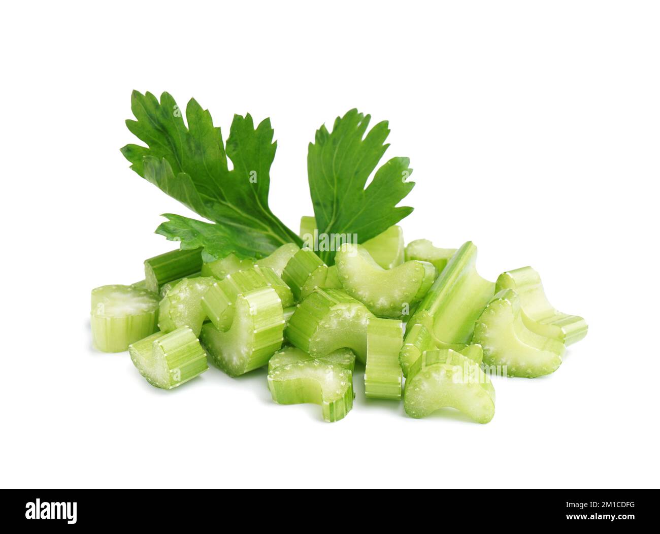 Heap of cut celery isolated on white background Stock Photo - Alamy