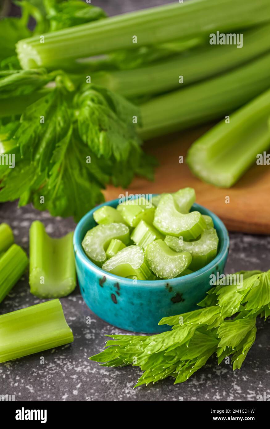 Bowl of fresh cut celery on grunge background Stock Photo - Alamy