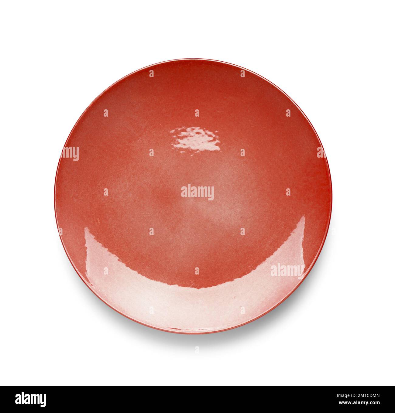 Red ceramic plate isolated on white background Stock Photo - Alamy
