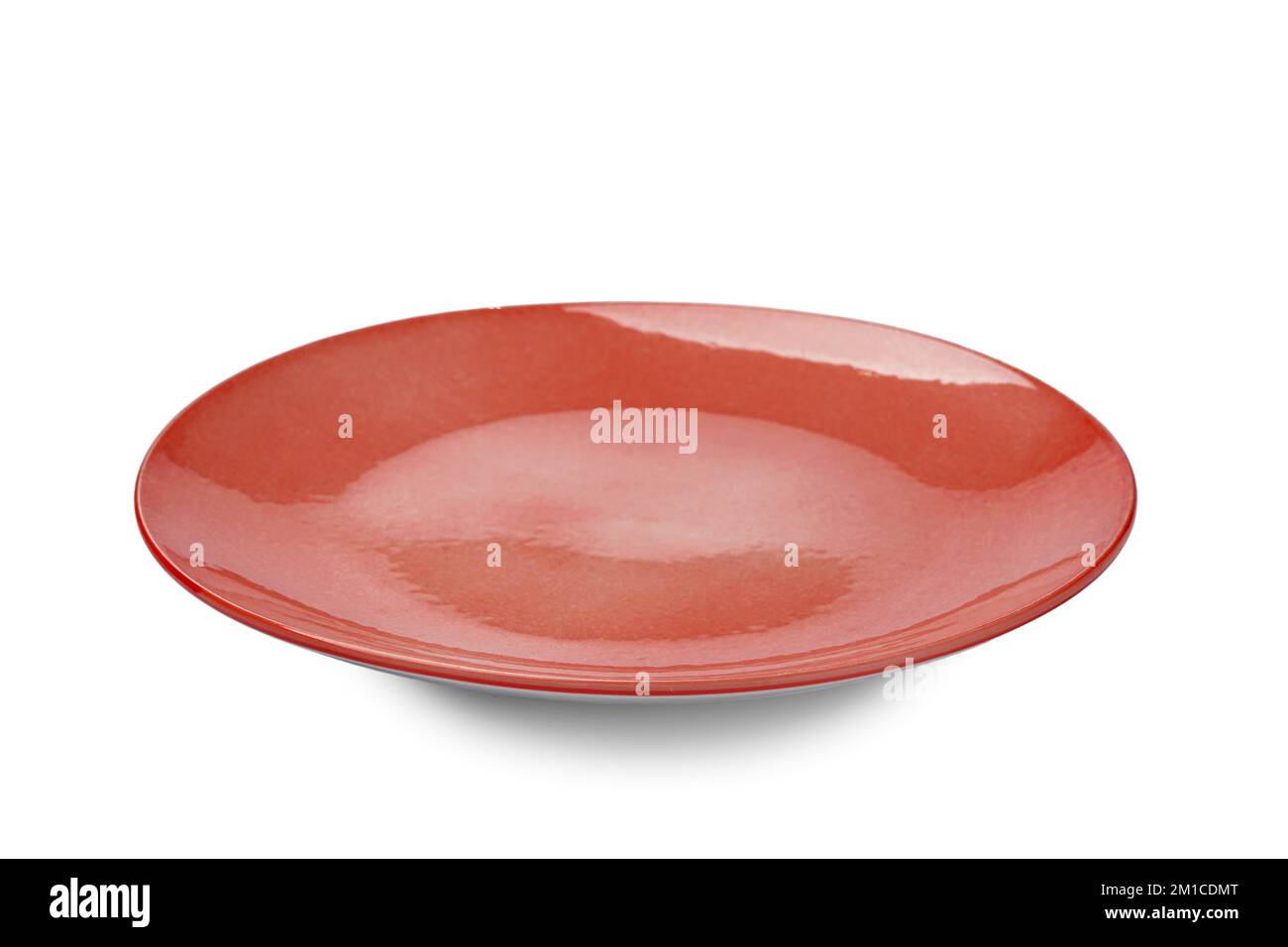 Red ceramic plate isolated on white background Stock Photo - Alamy