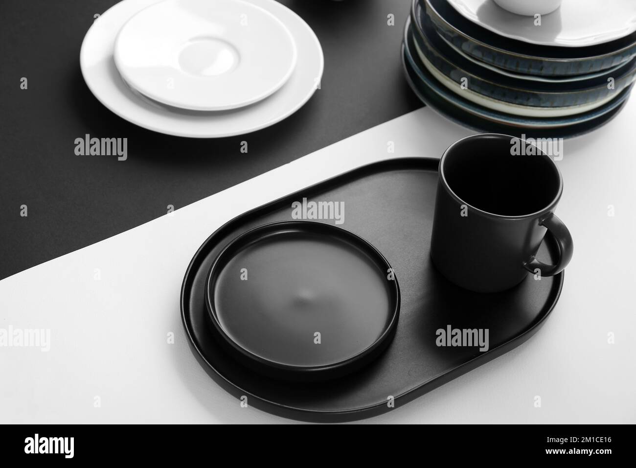 Table setting on black and white table, closeup Stock Photo - Alamy