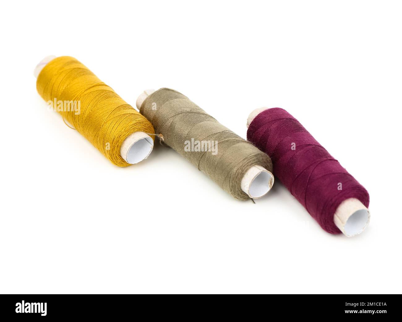 Sewing thread spools isolated on white background Stock Photo - Alamy