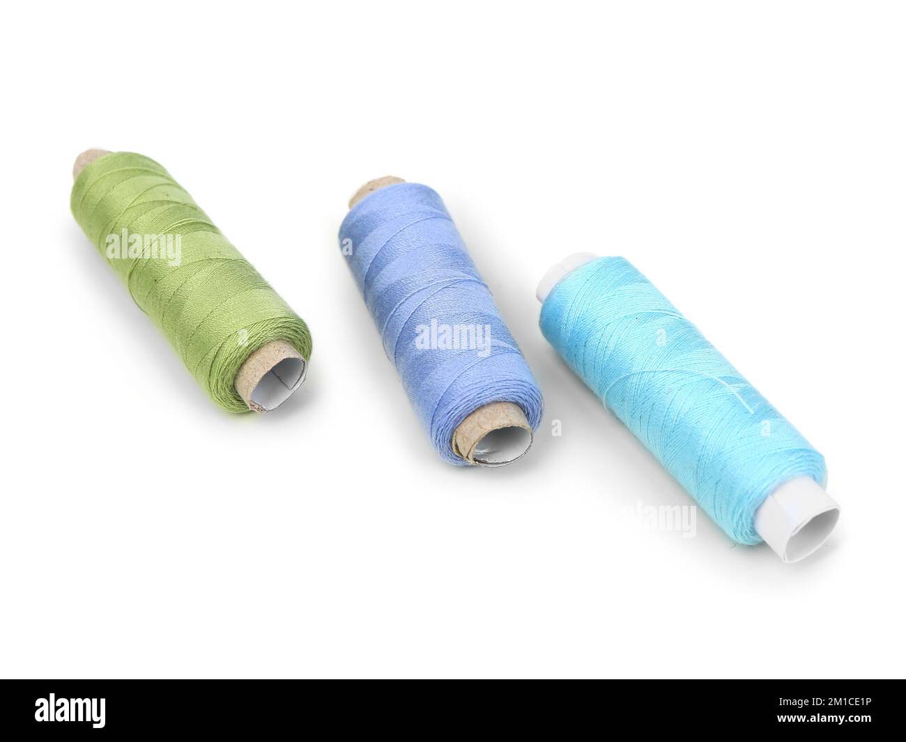 Sewing thread spools isolated on white background Stock Photo - Alamy