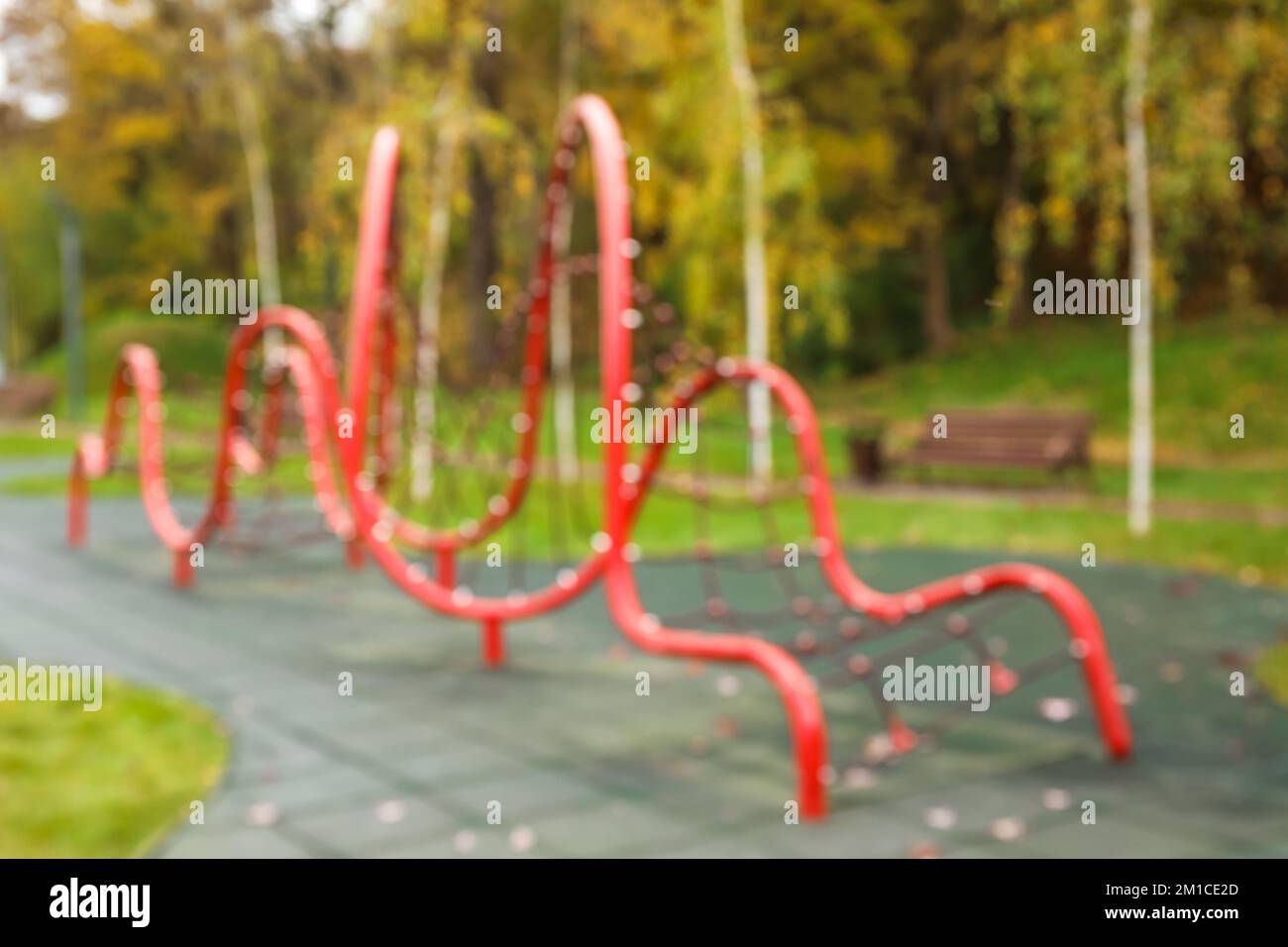 Blurred view of red climbing net on children's playground Stock Photo ...