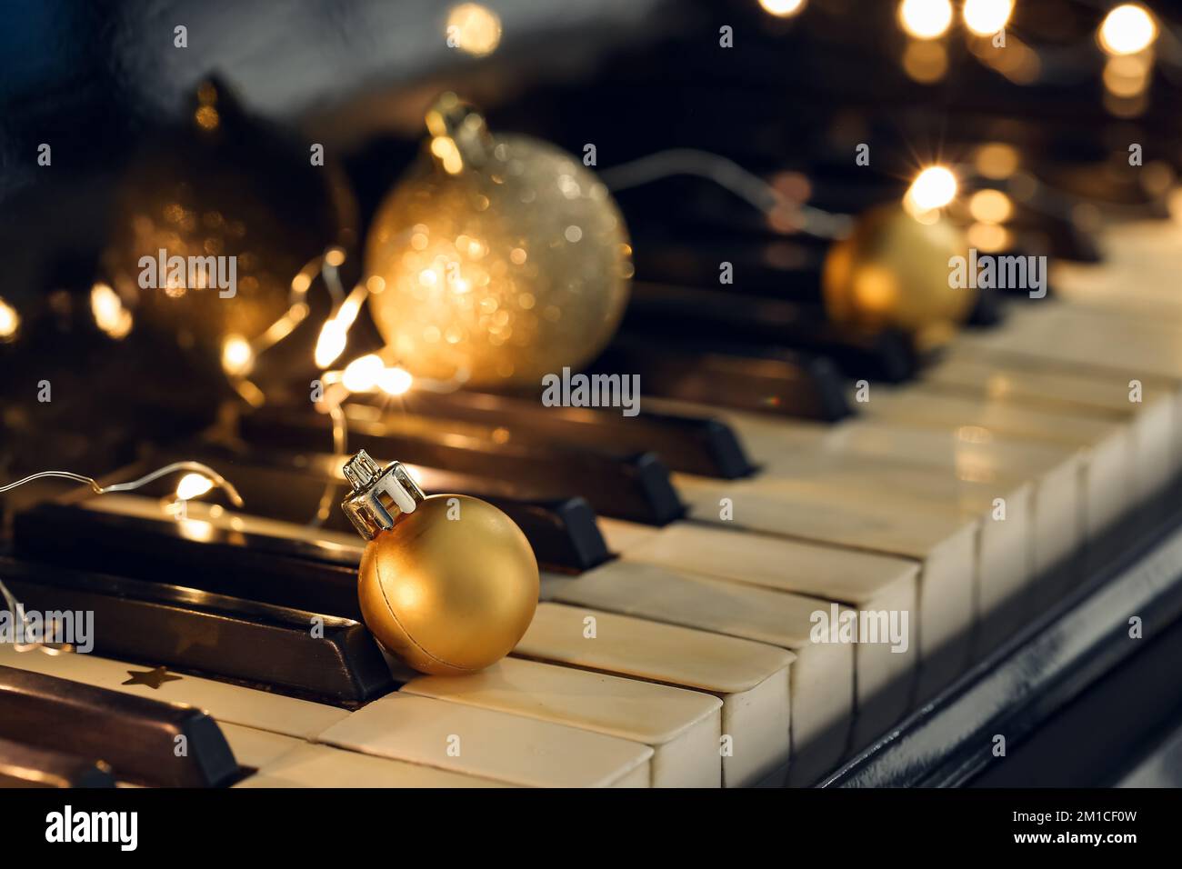 Christmas ball with glowing lights on piano keys, closeup Stock Photo ...