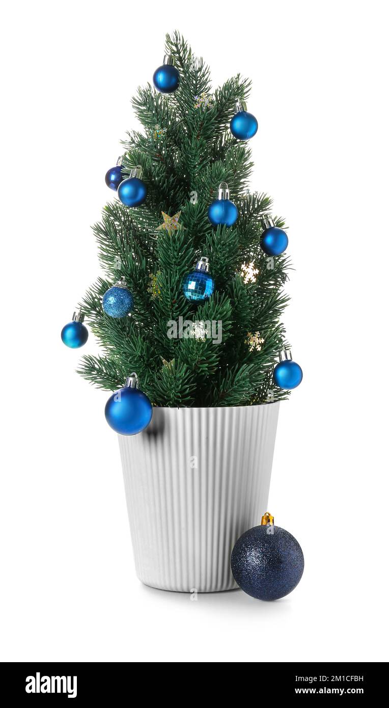 Small Christmas tree with decorations on white background Stock Photo ...