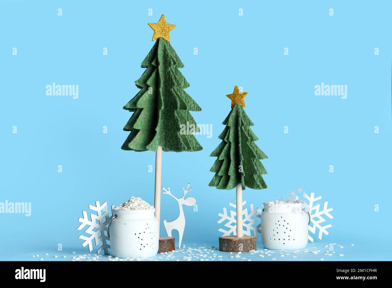 Composition with felt Christmas trees and decorations on color ...