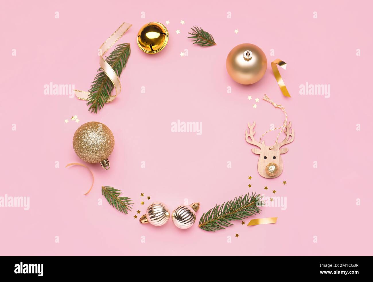 Frame made of beautiful Christmas decorations and fir branches on pink ...