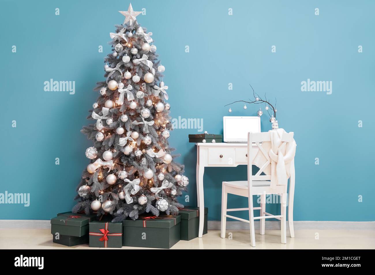 Interior of office with workplace and Christmas tree Stock Photo - Alamy