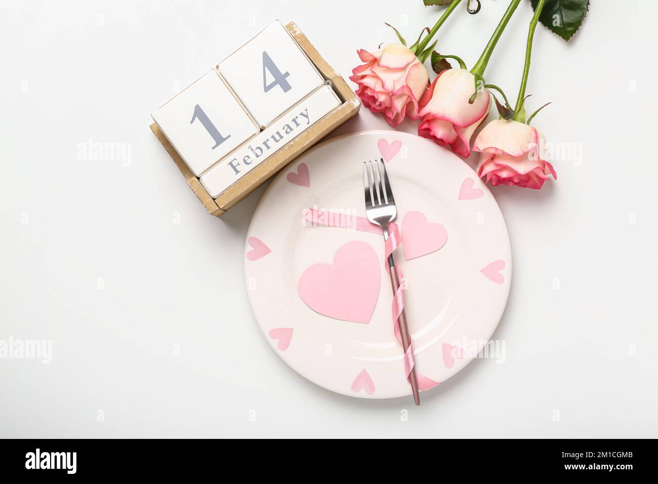 Cube calendar with date 14 FEBRUARY, table setting and roses on white ...