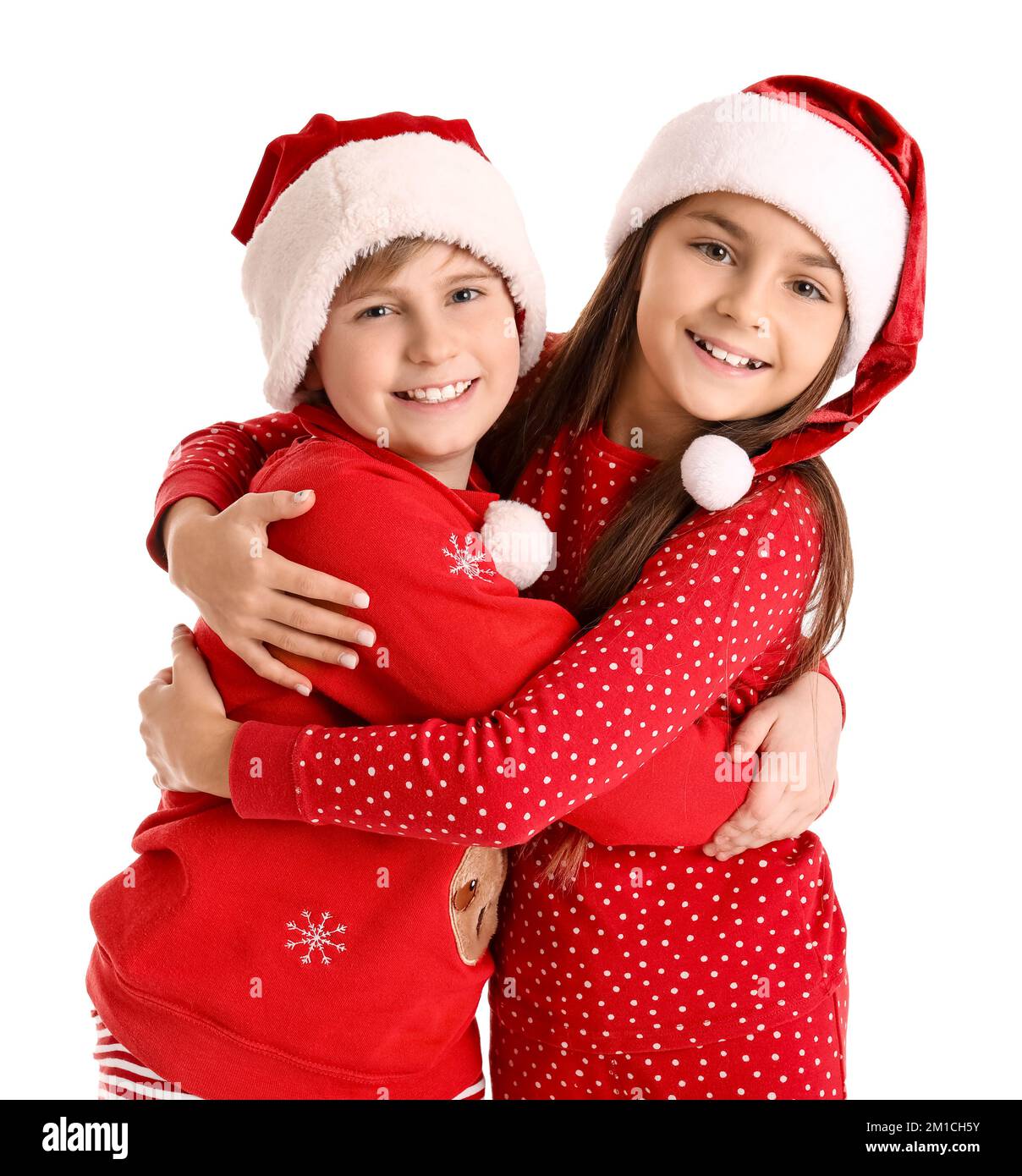 Little children in Santa hats hugging on white background Stock Photo ...