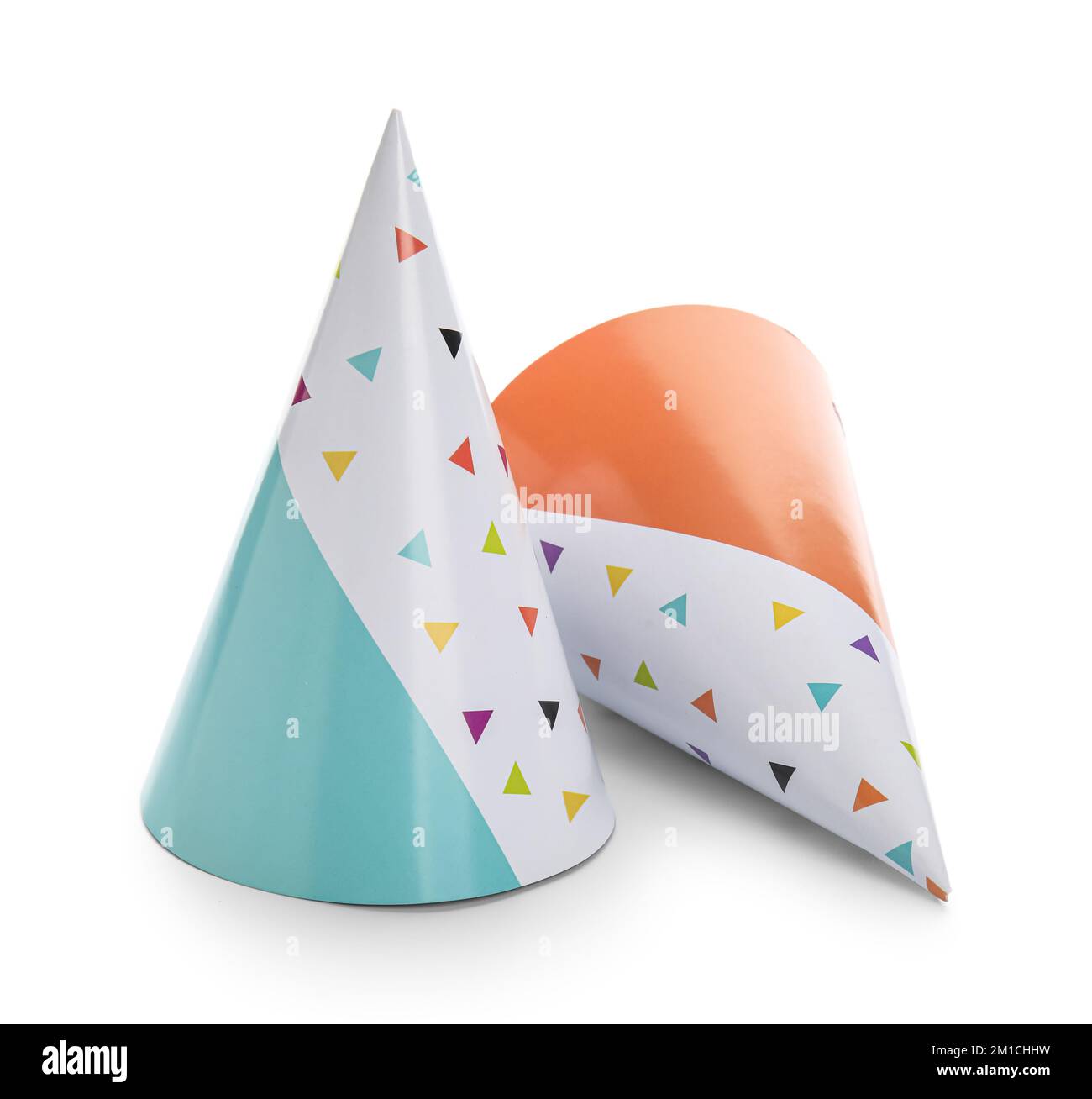 Blue and orange party hats on white background Stock Photo - Alamy