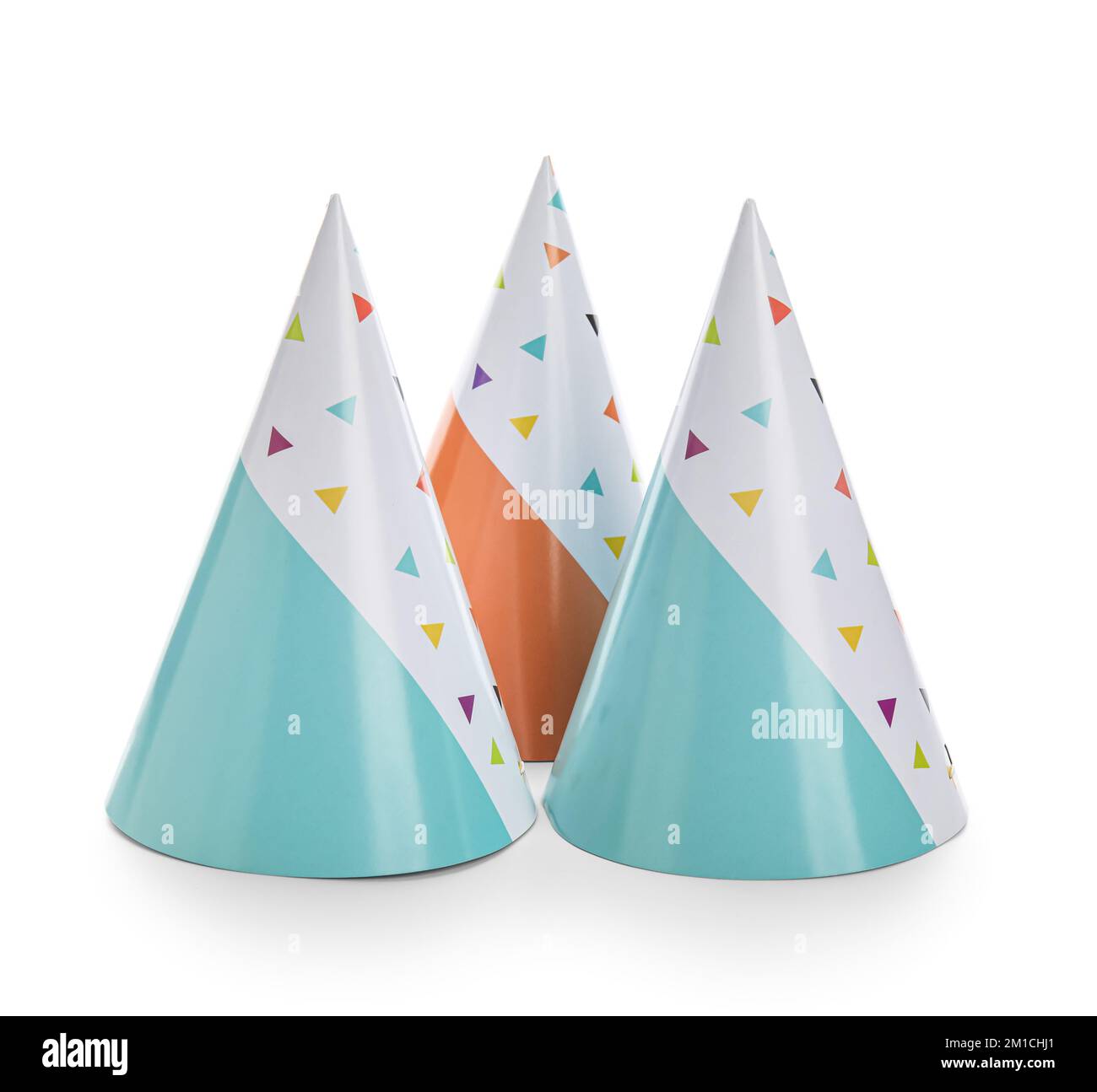Blue and orange party hats on white background Stock Photo - Alamy
