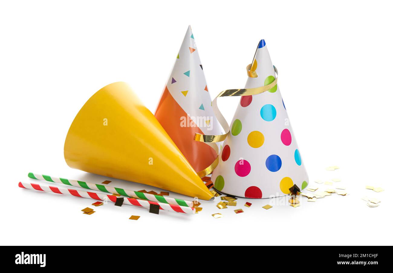 Colorful party hats with confetti and straws on white background Stock ...